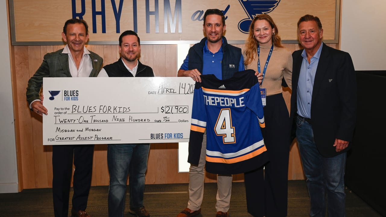 Morgan & Morgan presents donation to Blues for Kids | St. Louis Blues